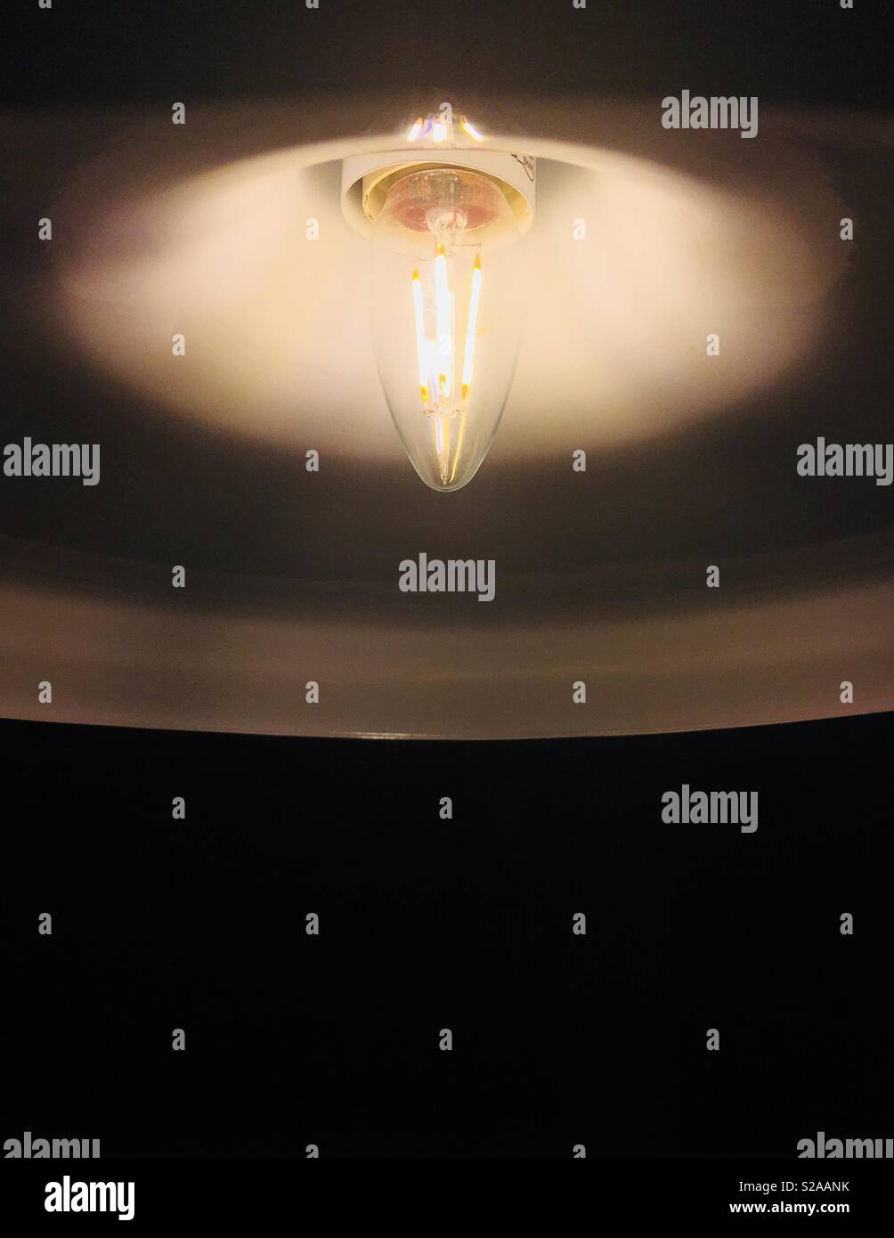 Light bulb with glowing element Stock Photo - Alamy