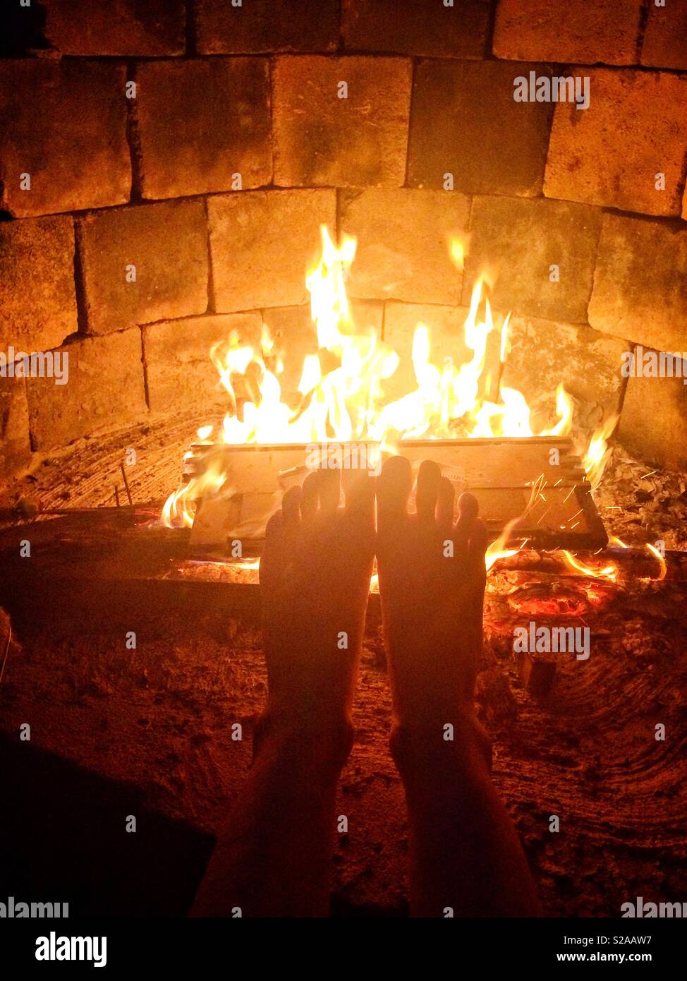 Feet fire home hi-res stock photography and images - Alamy