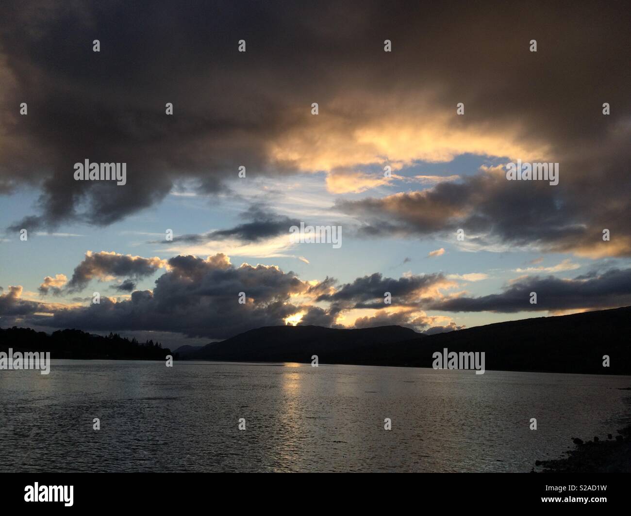 Sunset on the loch Stock Photo - Alamy