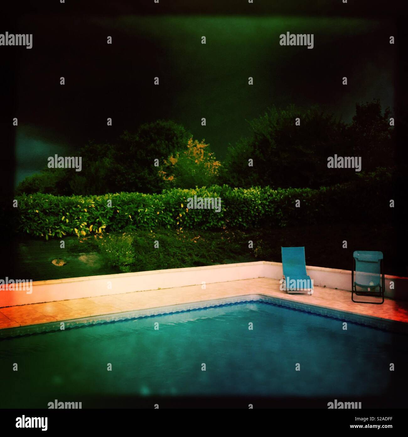 Storm over the swimming pool Stock Photo - Alamy