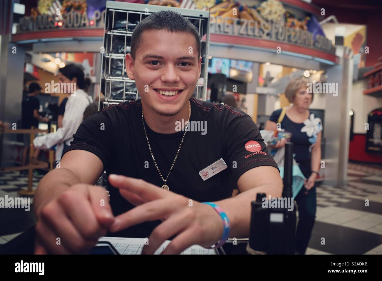 Guy at the ticket booth Stock Photo - Alamy