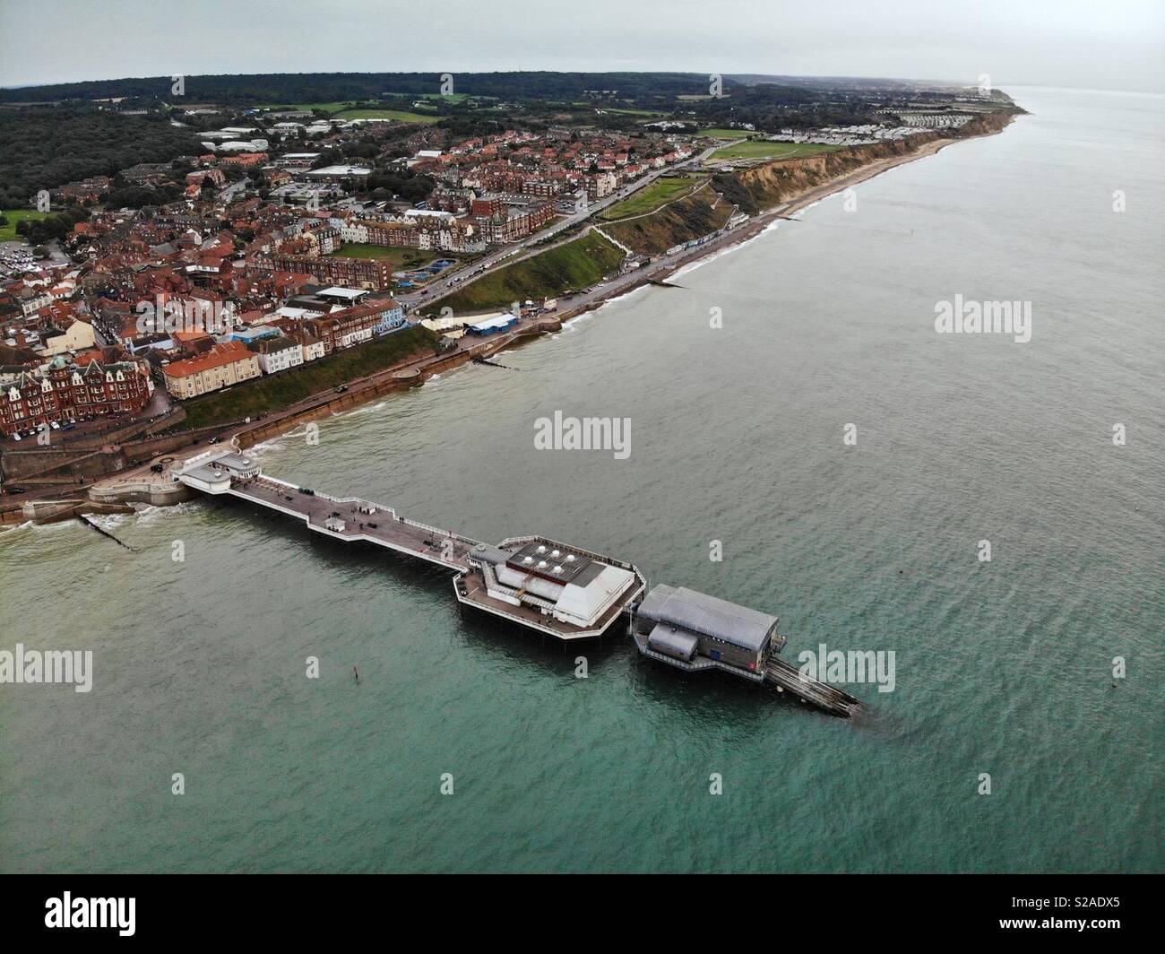 Aerial shot of Cromer pier from out to sea looking towards the town at ...