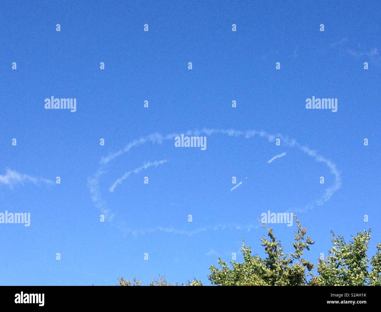 Skywriting smiley face Stock Photo - Alamy