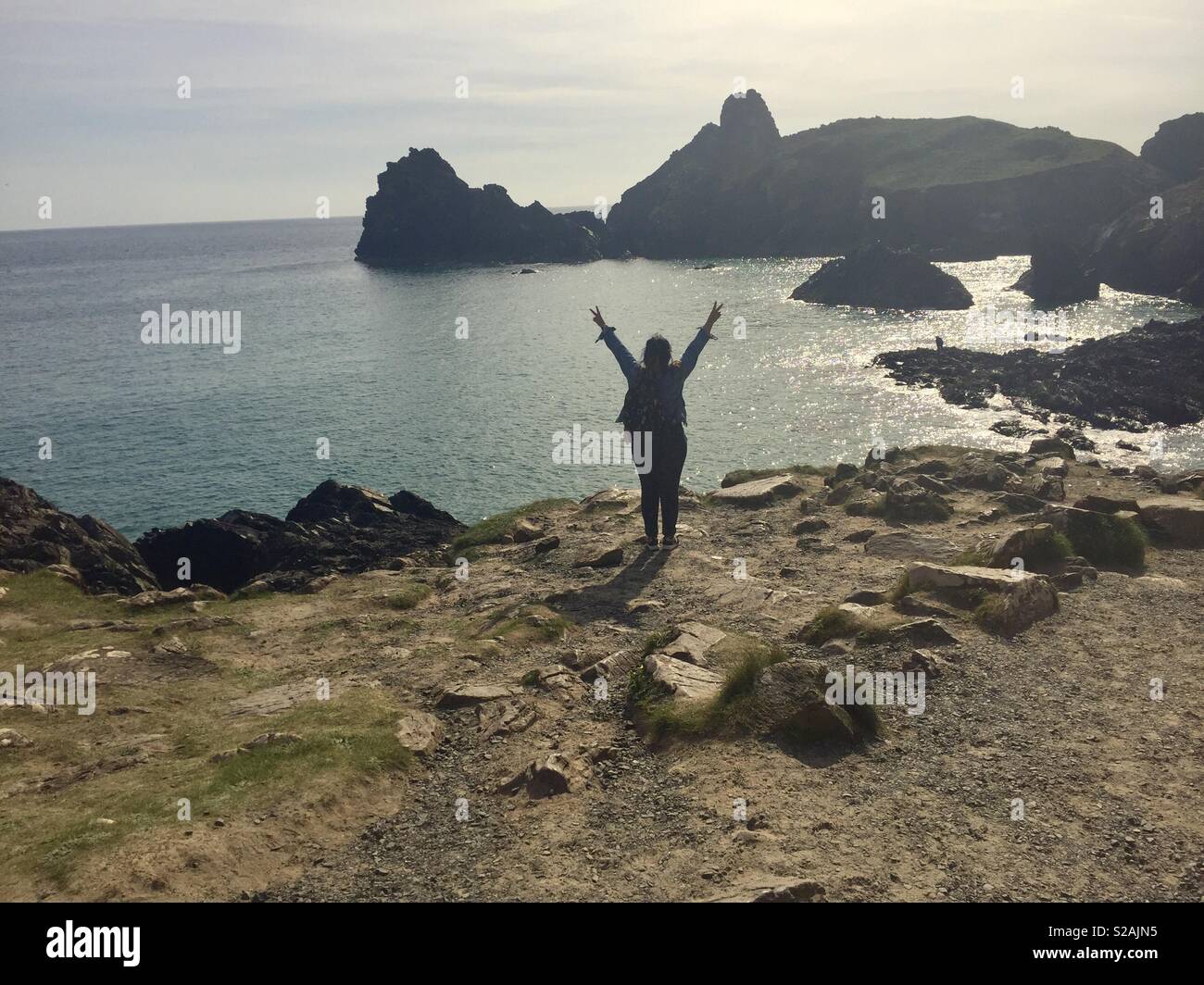 Girl by the cliff in The Lizard, Cornwall Stock Photo - Alamy