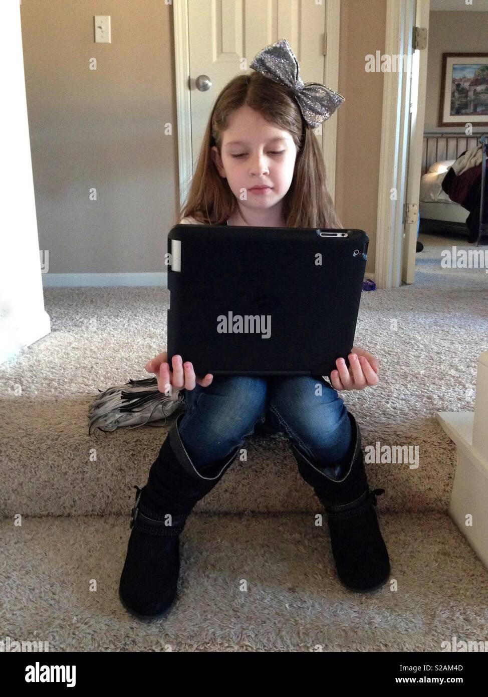 Girl Looking at a Computer Stock Photo - Alamy