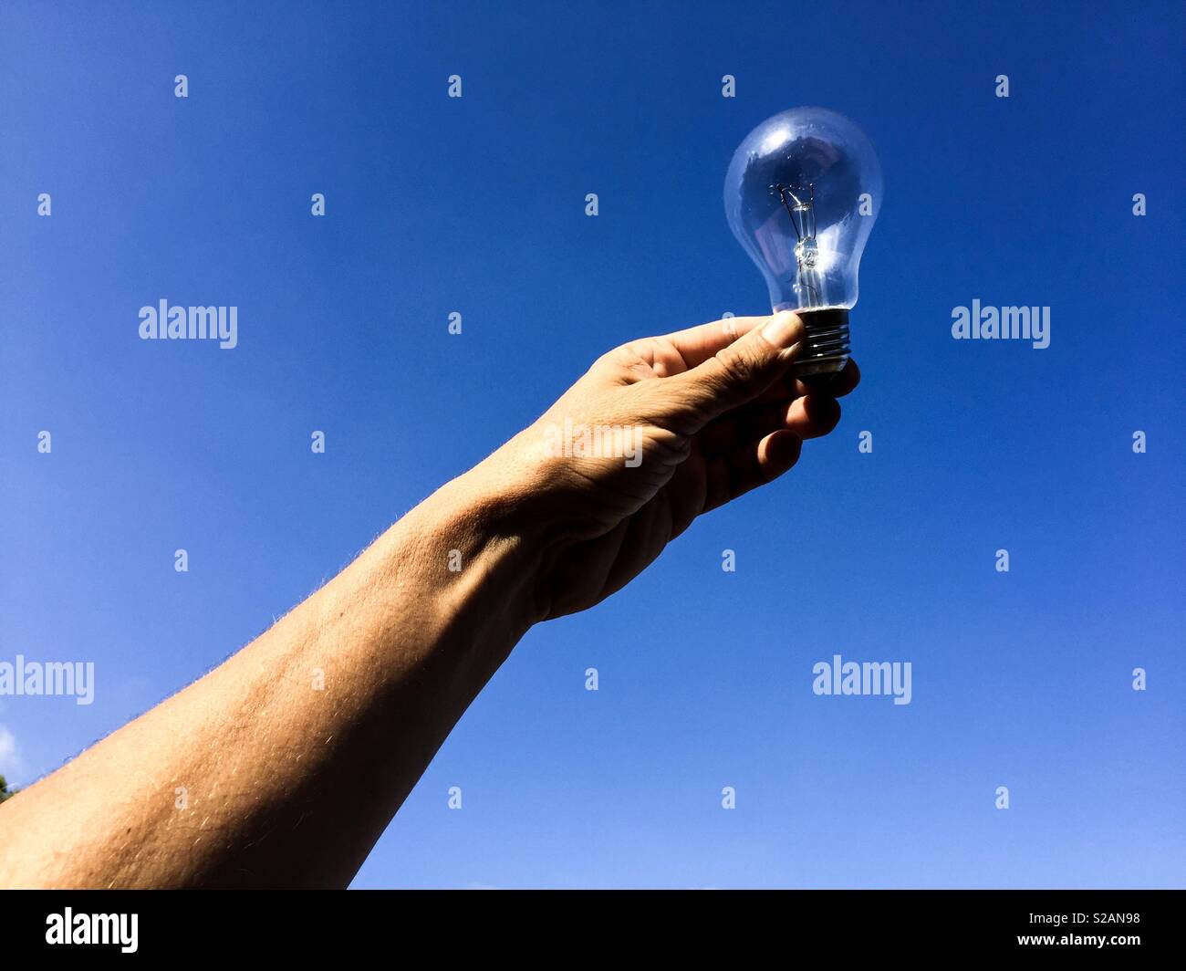 Hold a light bulb hi-res stock photography and images - Alamy
