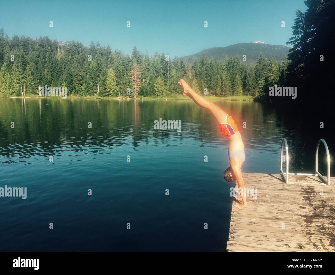 Handstand diving hi-res stock photography and images - Alamy