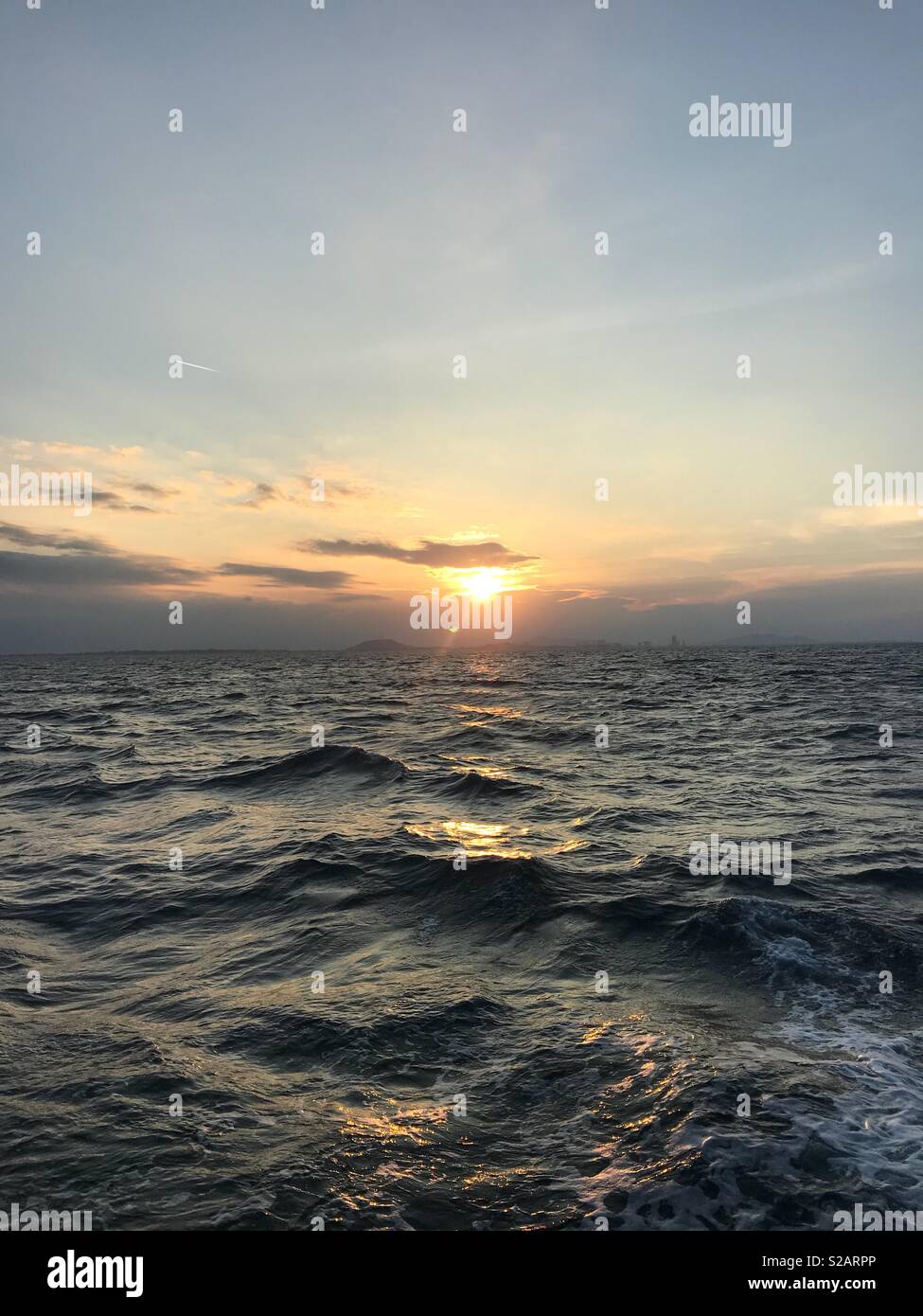 Sunset from the middle of the ocean Stock Photo - Alamy