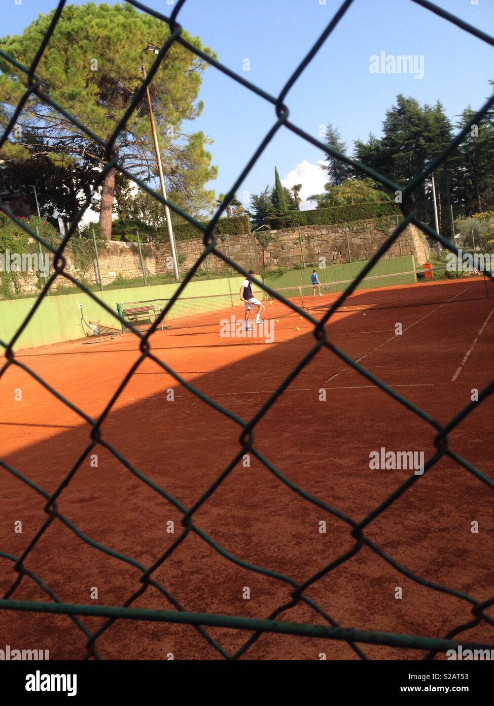 a tennis court at the sunset Stock Photo - Alamy