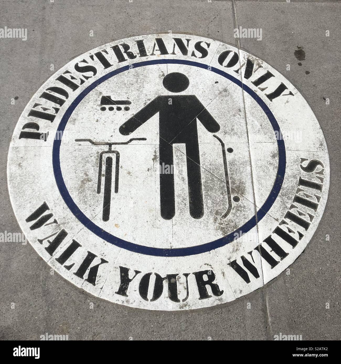 A sidewalk sign that says Pedestrians Only, Walk You Wheels Stock Photo ...