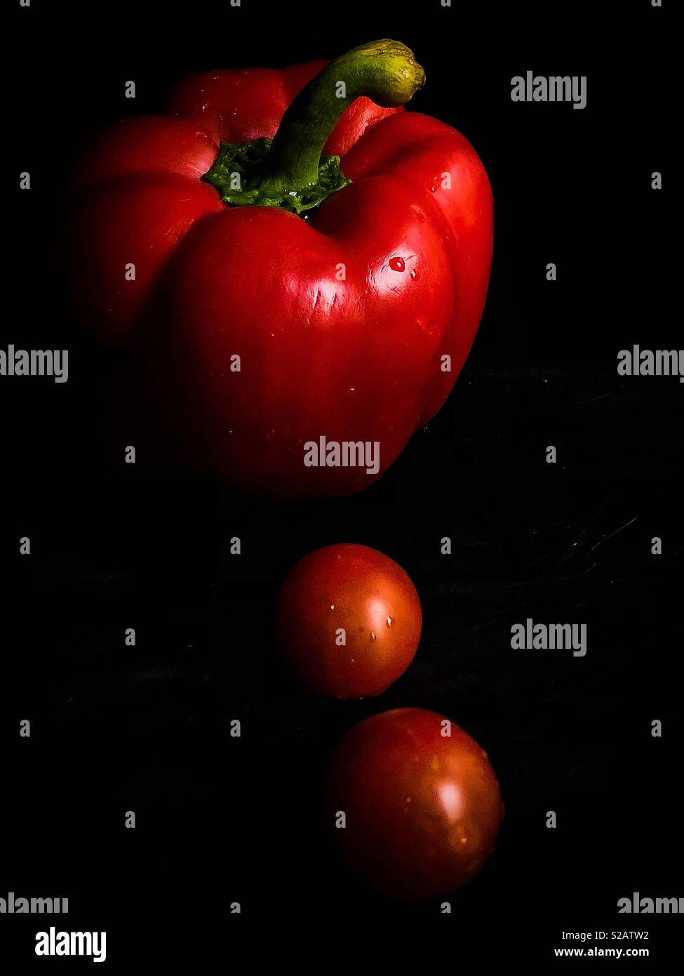 Three red pepper Stock Photo - Alamy