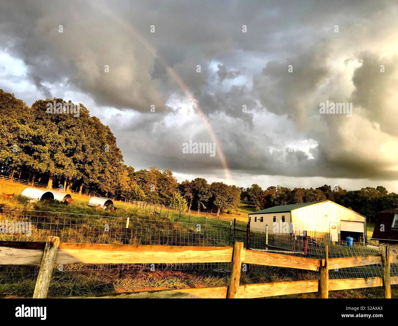 Rainbow over farm hi-res stock photography and images - Alamy