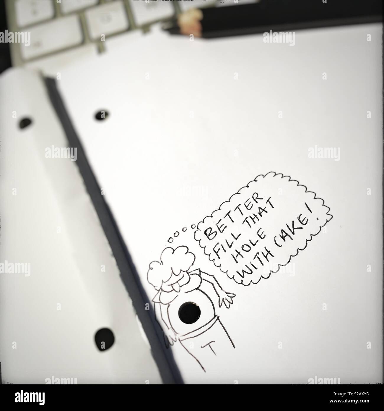 Doodle on paper, using file hole to represent a hunger for cake Stock ...