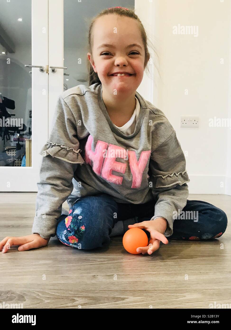 Beautiful girl with Down Syndrome Stock Photo - Alamy