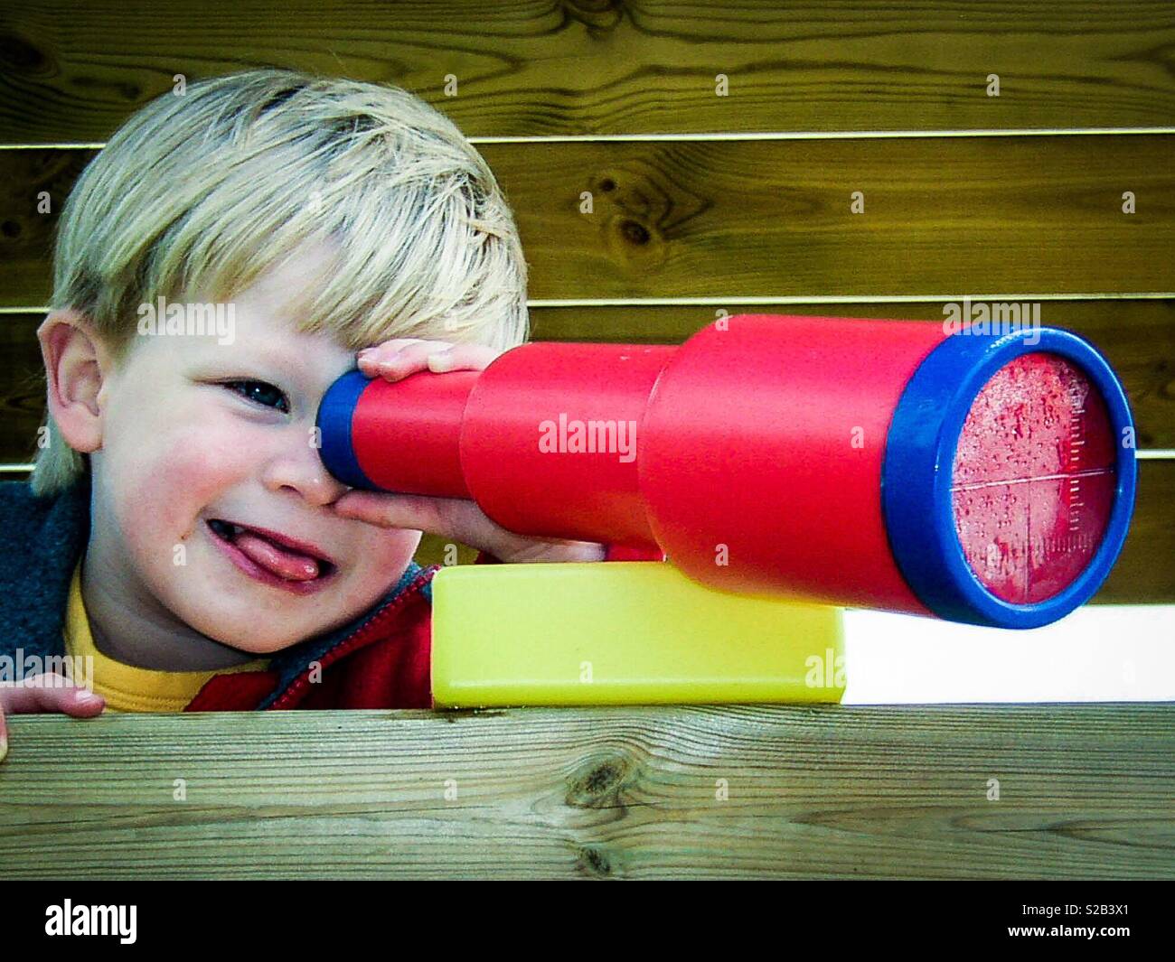 Child Looking Through Toy Telescope Stock Photo - Alamy