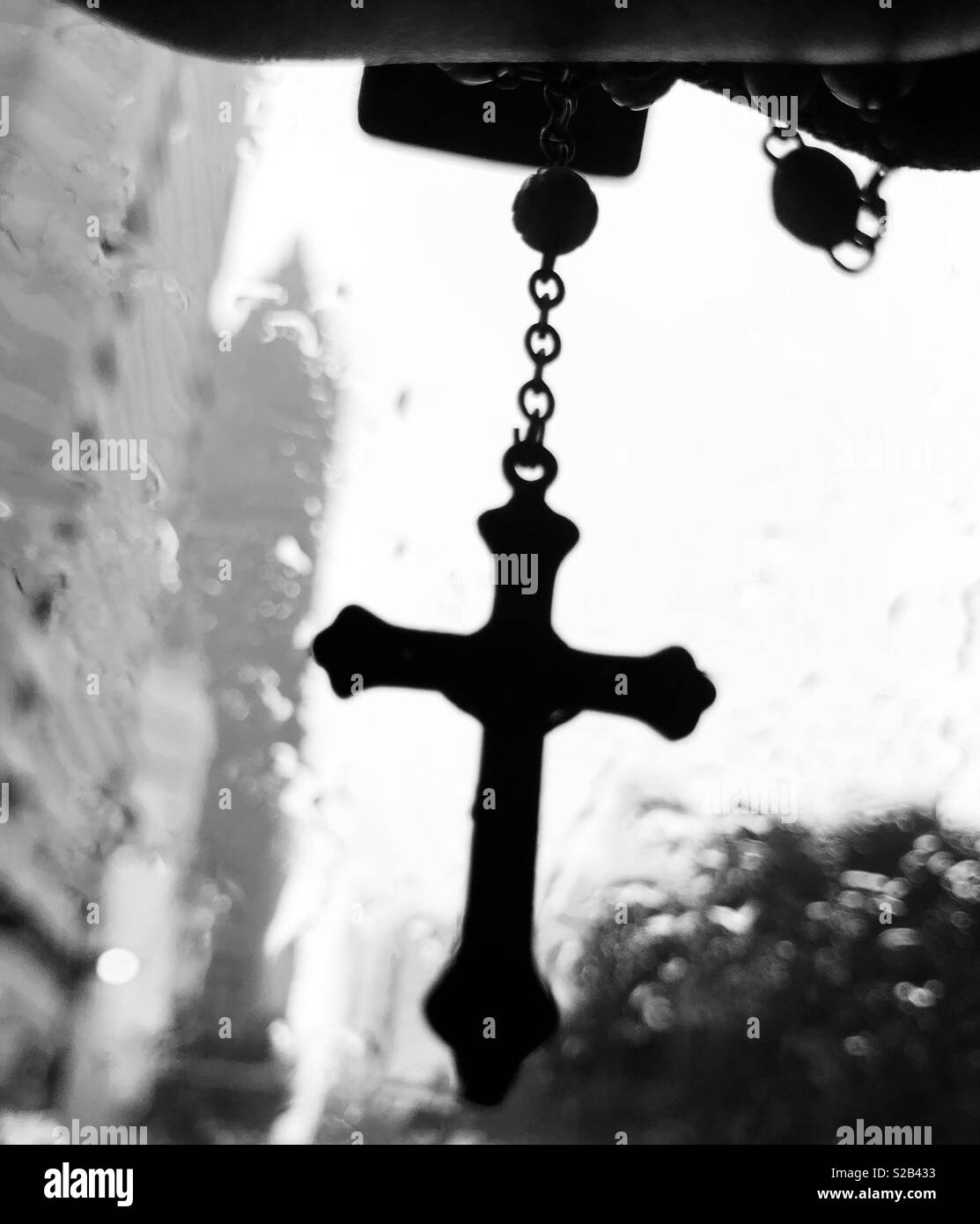 Cross hanging on mirror Black and White Stock Photos & Images - Alamy
