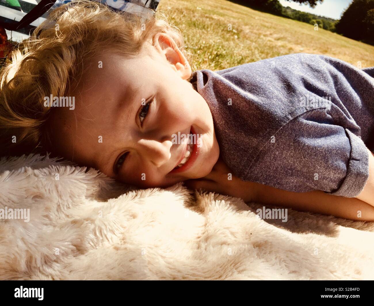 Boy sunbathing hi-res stock photography and images - Alamy