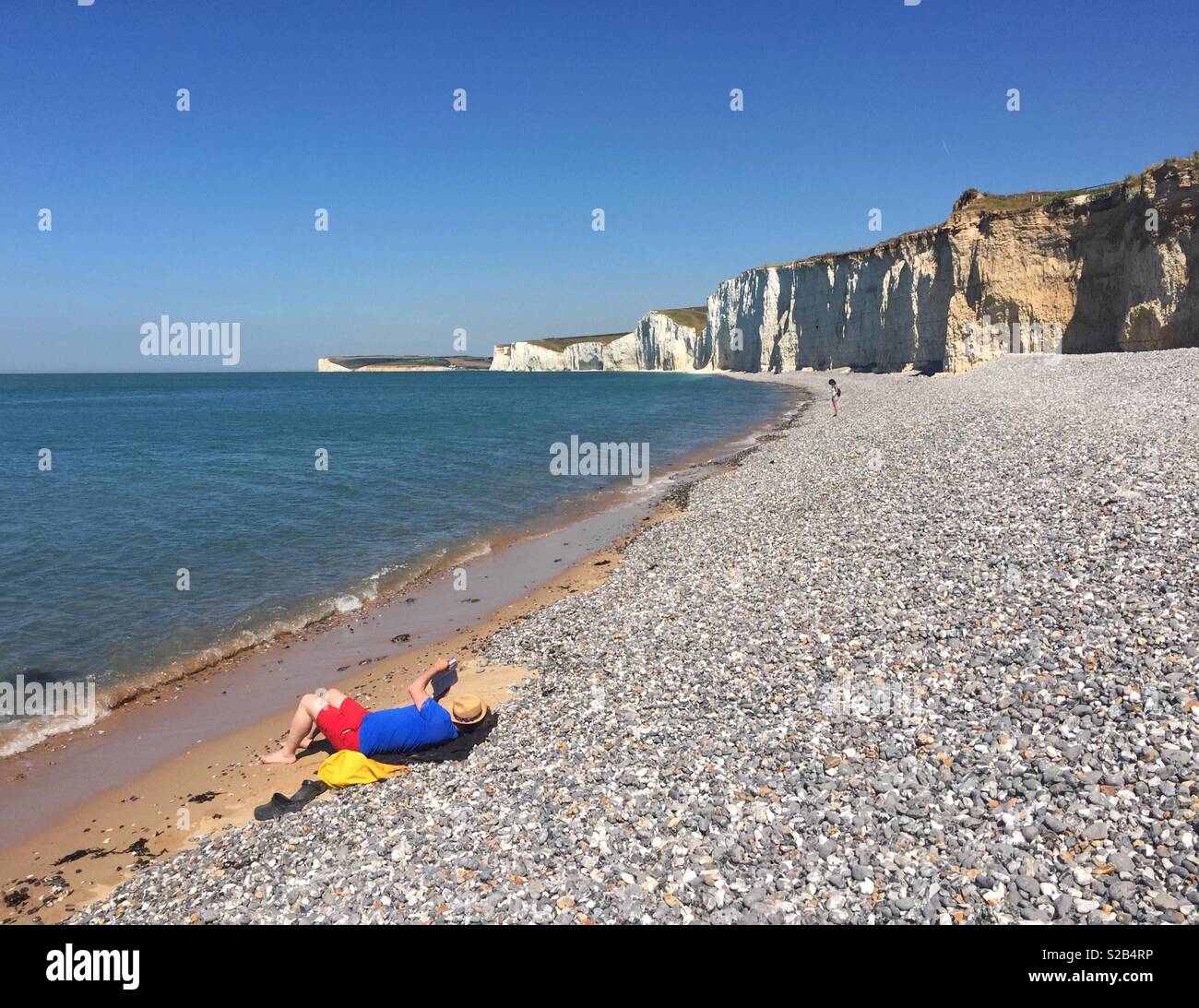 Man lying on beach hi-res stock photography and images - Alamy