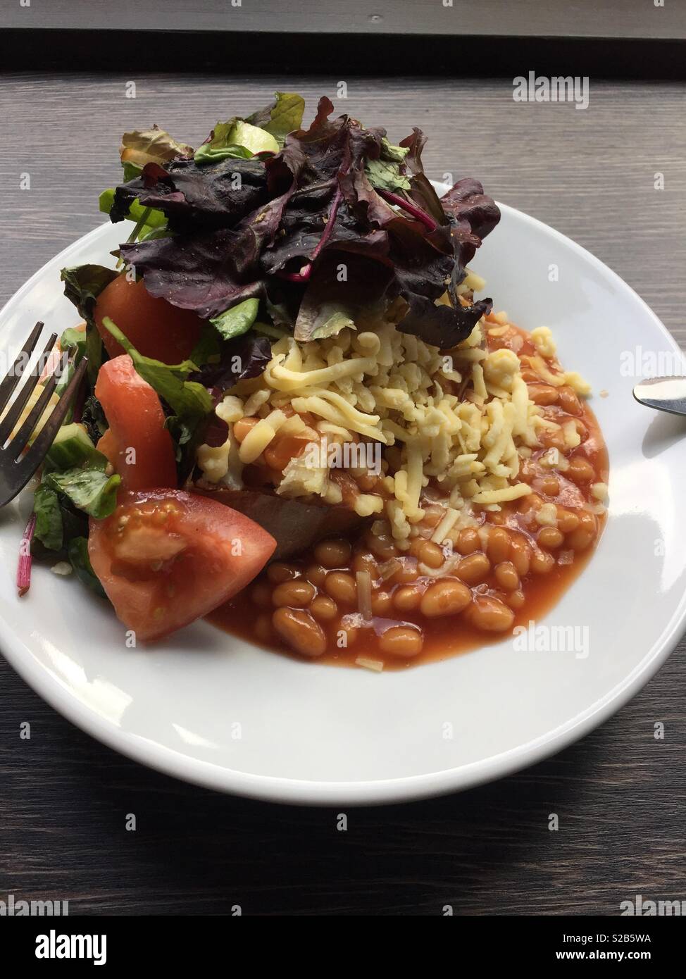 Jacket potato cheese beans salad hi-res stock photography and images ...