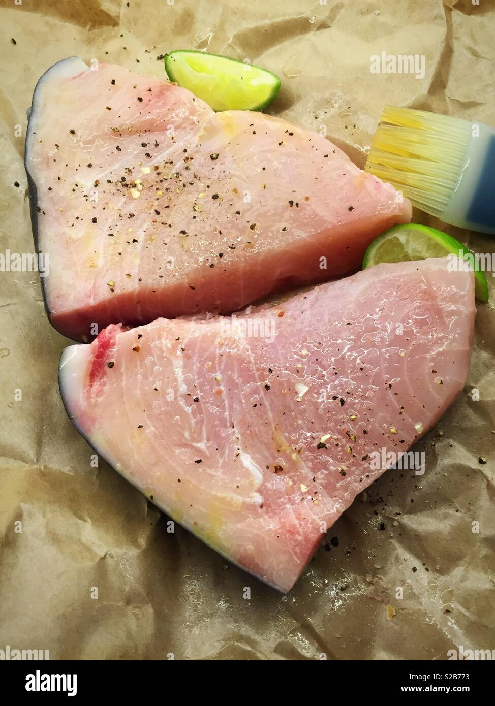 Raw swordfish steaks being prepared for cooking, close up, USA Stock ...