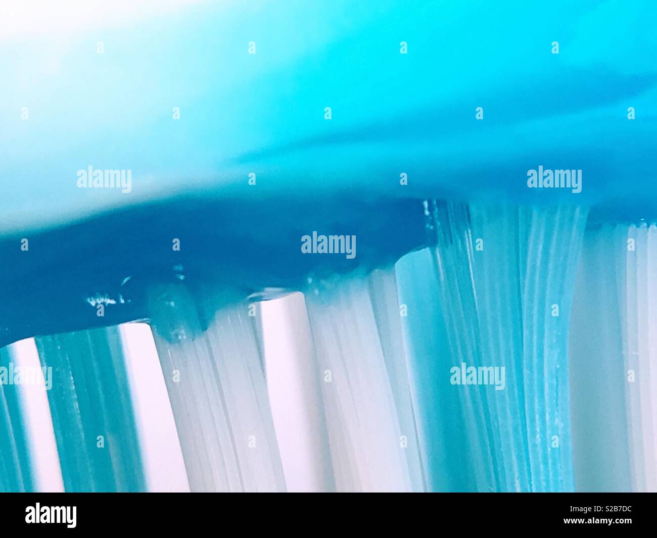 Toothbrush with blue toothpaste hi-res stock photography and images - Alamy
