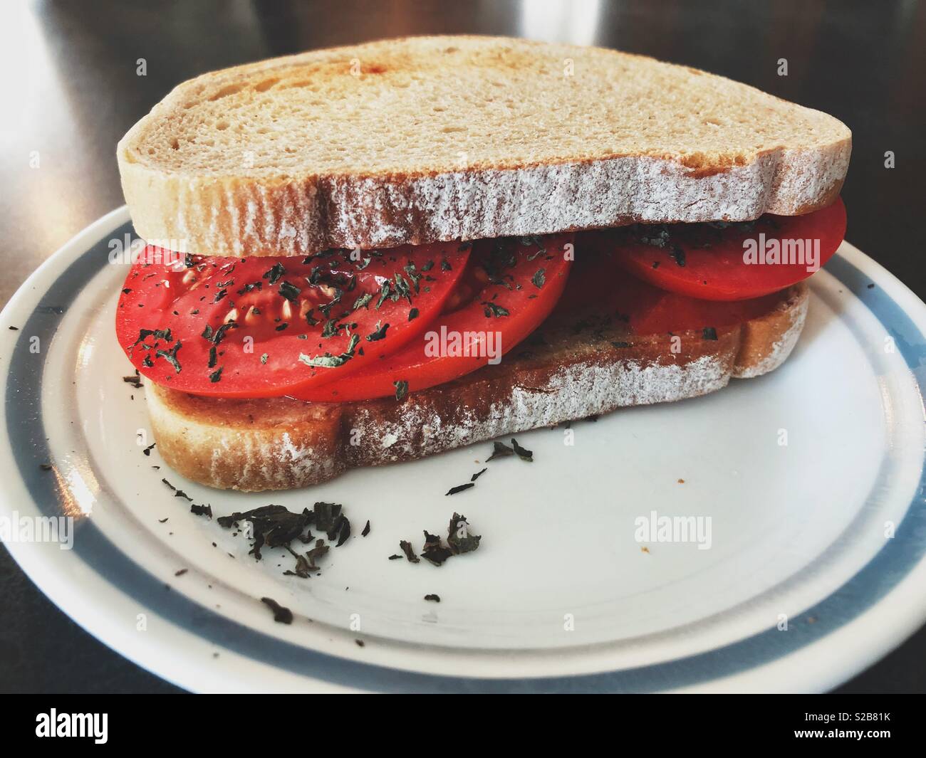 Toasted tomato and dried basil sandwich on rye bread Stock Photo - Alamy
