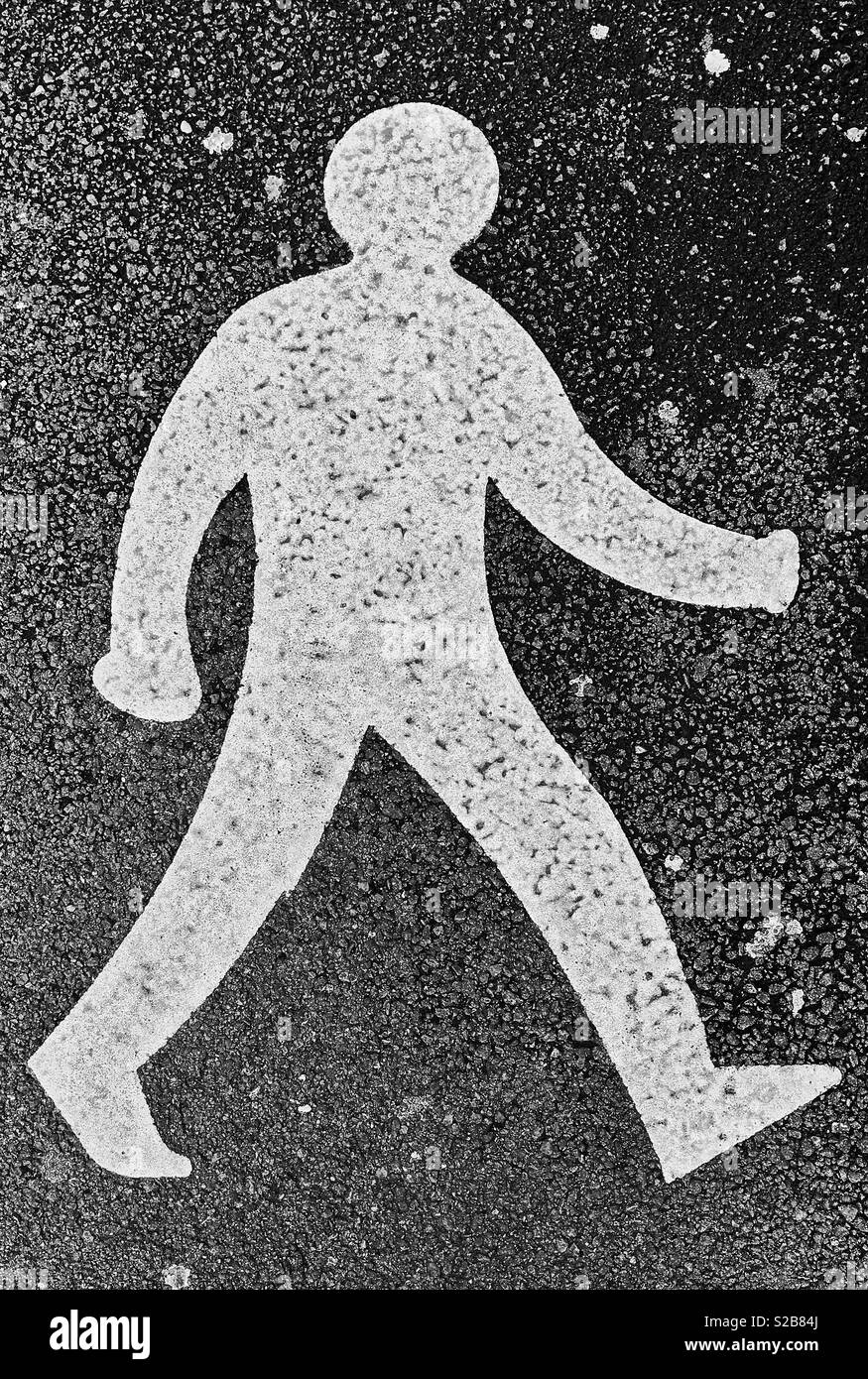 Walking man sign on black and white smartphone stock photos - Alamy