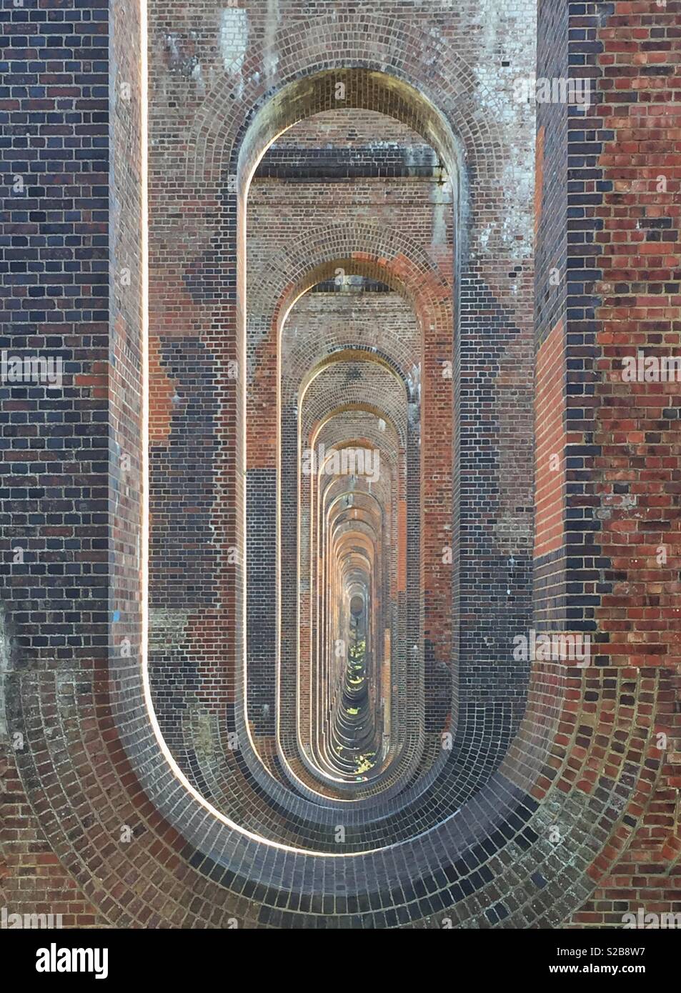 Looking through the ever decreasing arches of the Balcombe Viaduct in ...