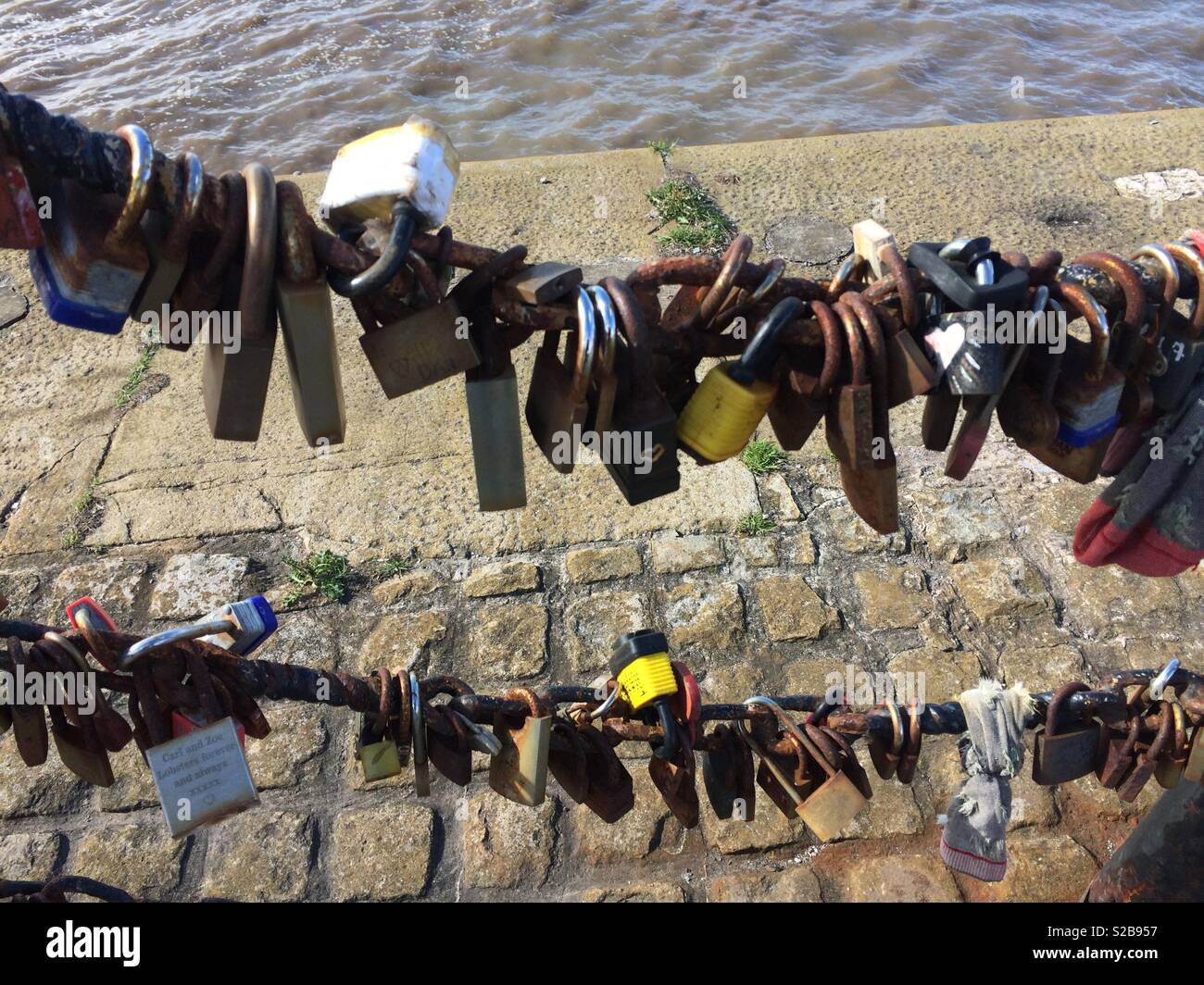 Locks on chain Stock Photo - Alamy