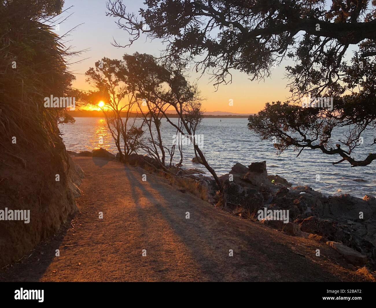 Sunset on the walking track around Mount Maunganui Stock Photo - Alamy