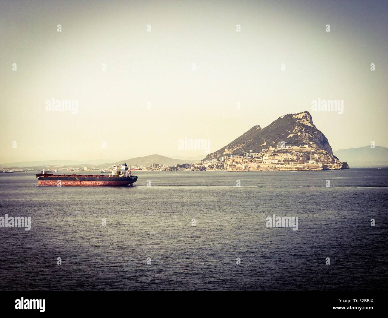 Container ship passing the Rock of Gibraltar Stock Photo - Alamy