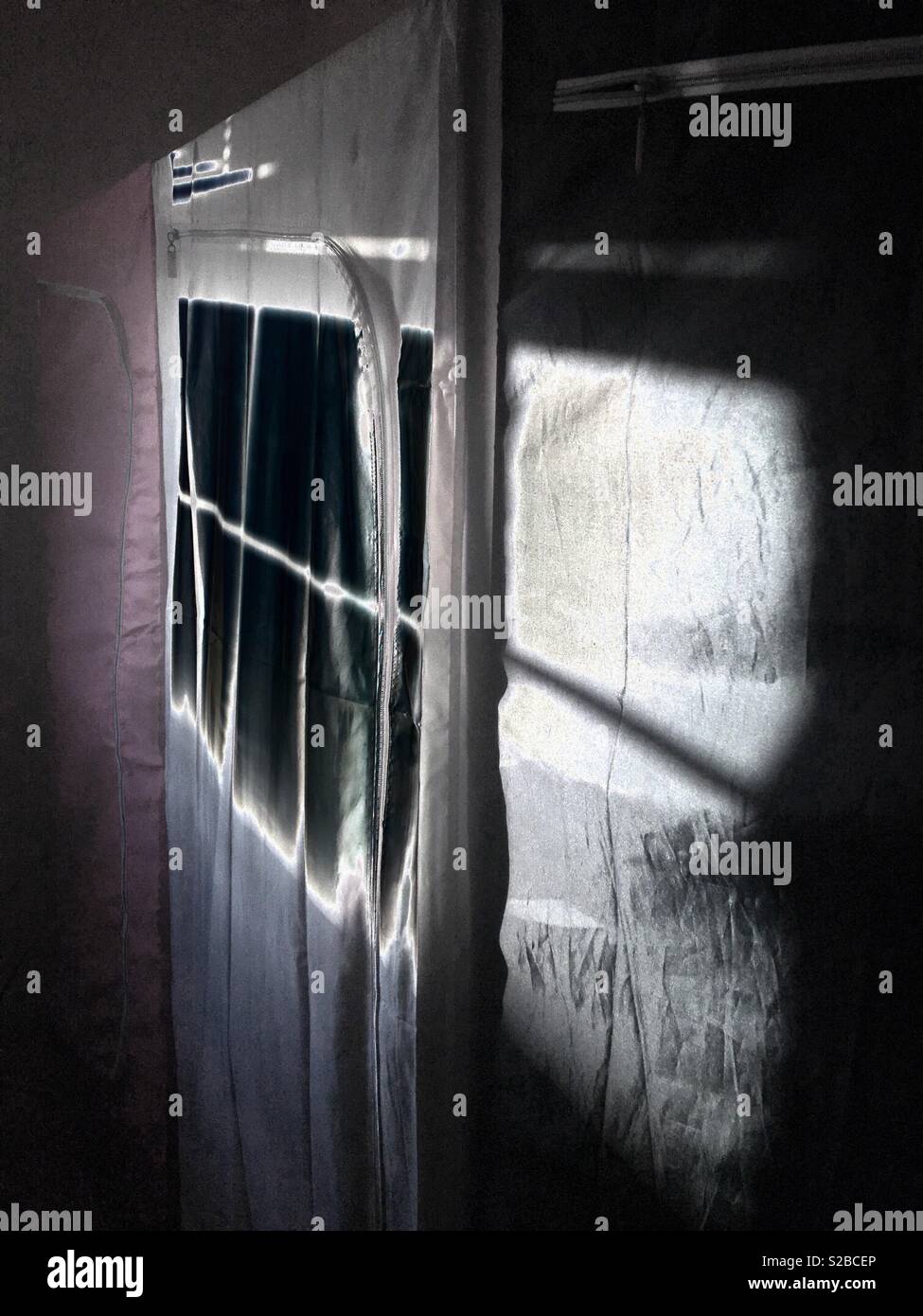 The plastic wardrobes in positive and negative looks Stock Photo - Alamy