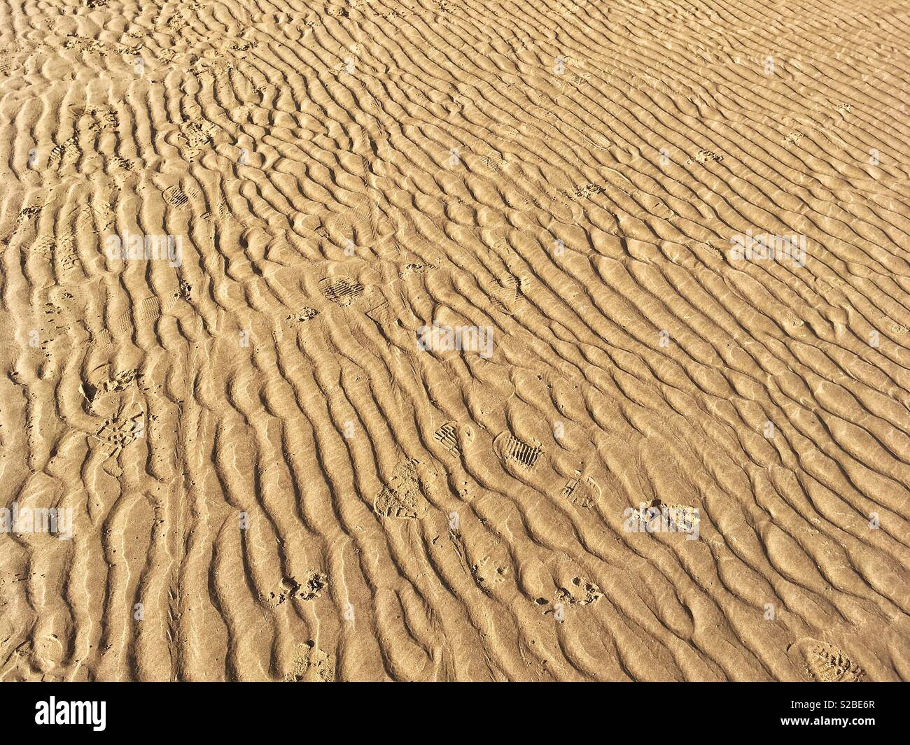 Patterns in the sand on a beach Stock Photo - Alamy