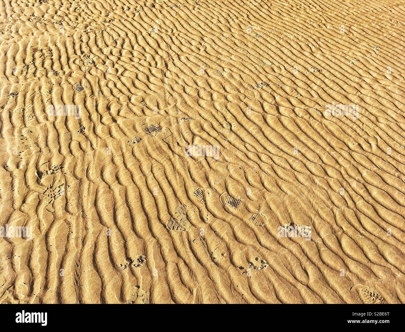 Patterns in the sand on a beach Stock Photo - Alamy