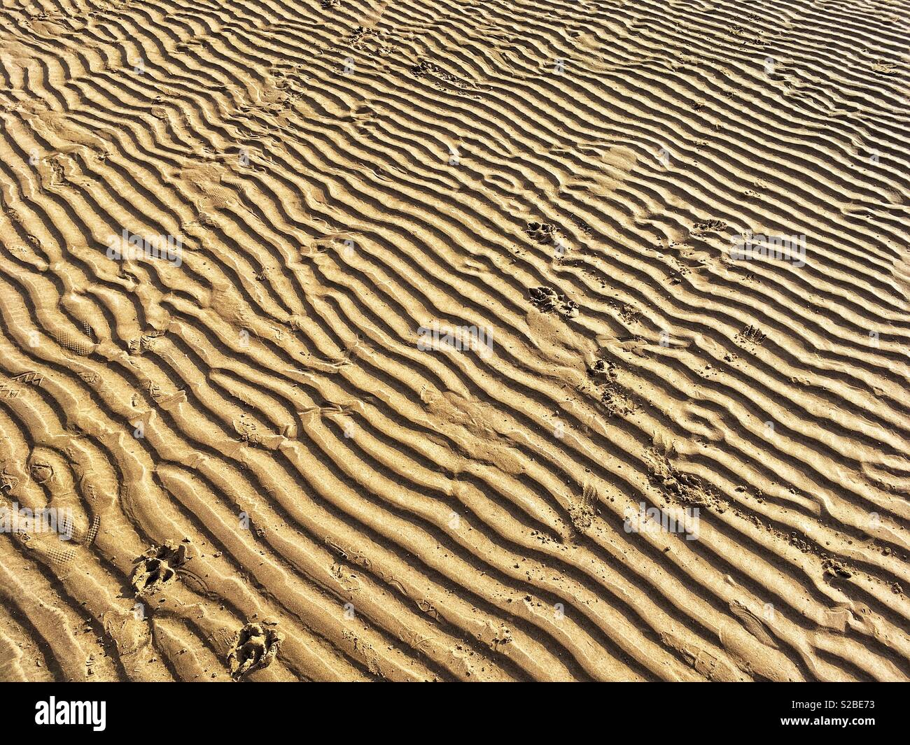 Patterns in the sand on a beach Stock Photo - Alamy