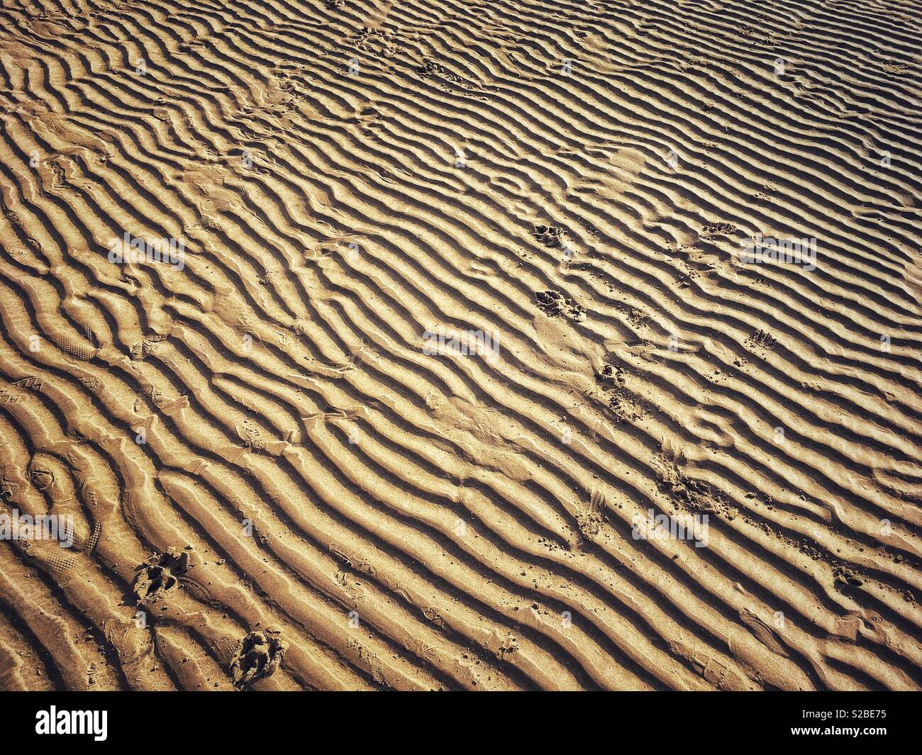 Patterns in the sand on a beach Stock Photo - Alamy