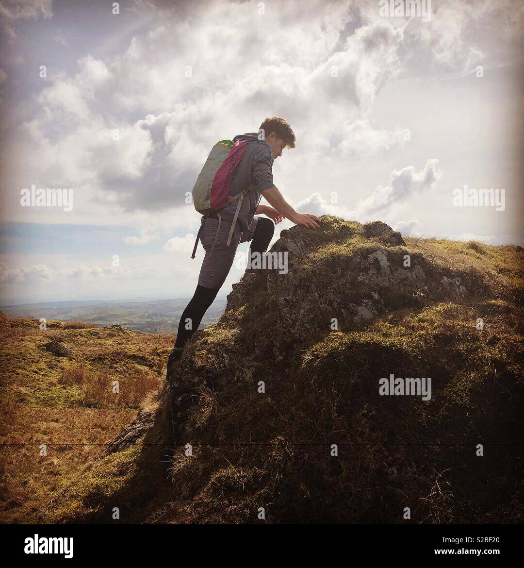 Climber at the summit Stock Photo - Alamy