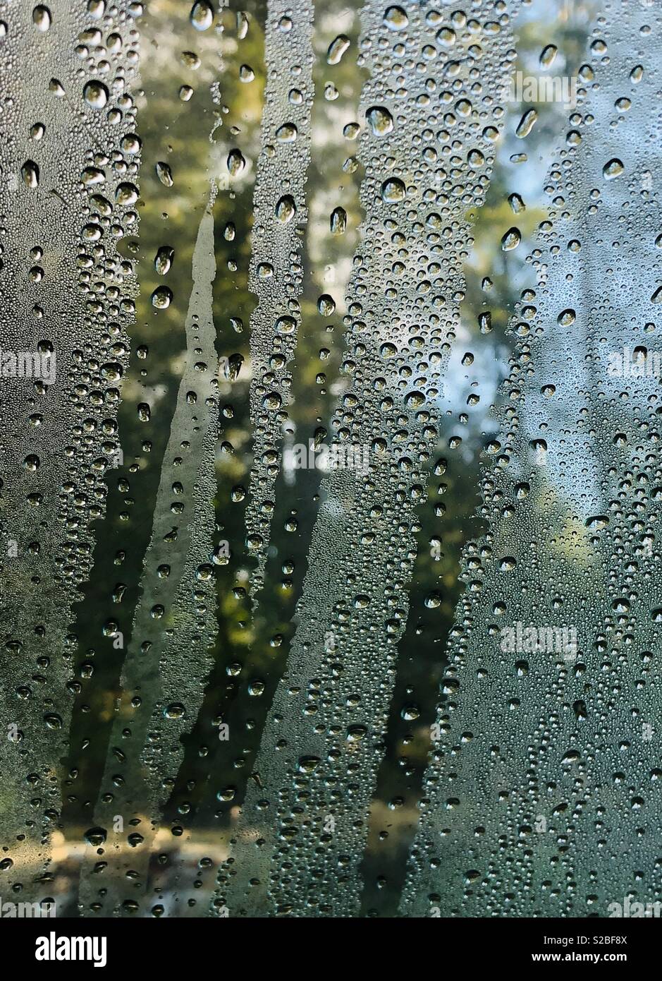 Car windshield - raindrops sliding down - abstract Stock Photo - Alamy