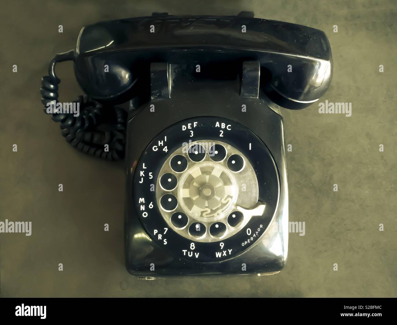Old vintage rotary dial black telephone Stock Photo - Alamy