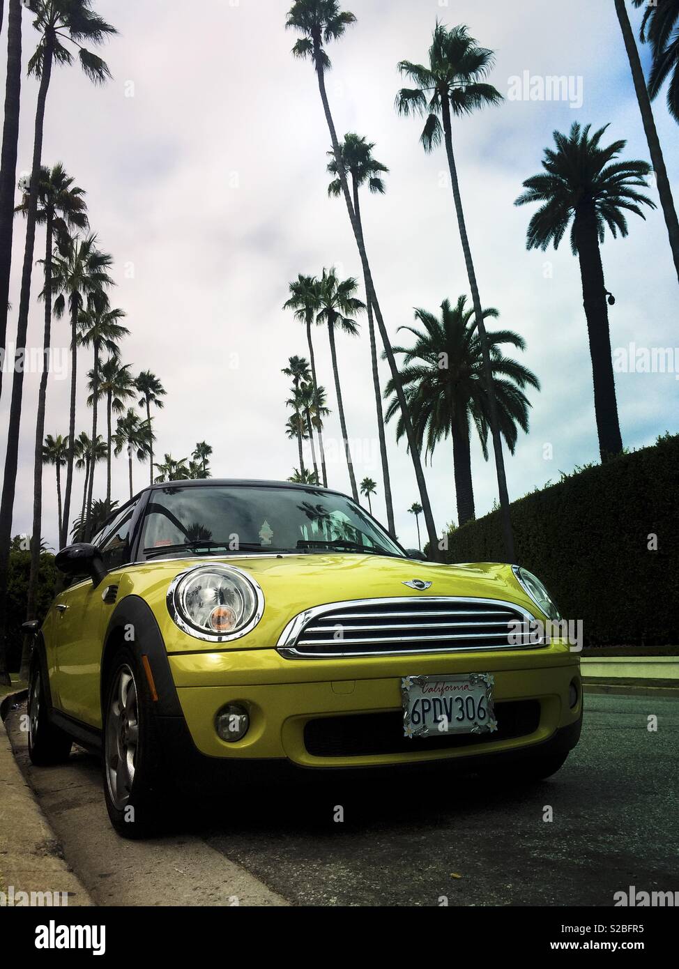 Colorful yellow mini car on Rodeo Drive, Beverly Hills, Los Angeles ...