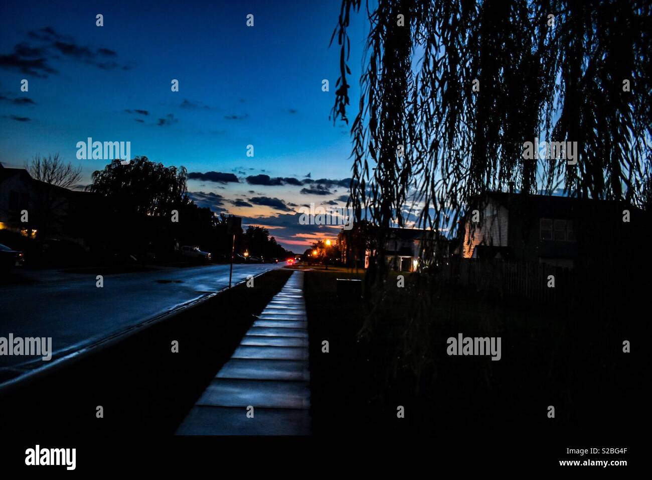 Subdivision with sun almost set Stock Photo - Alamy