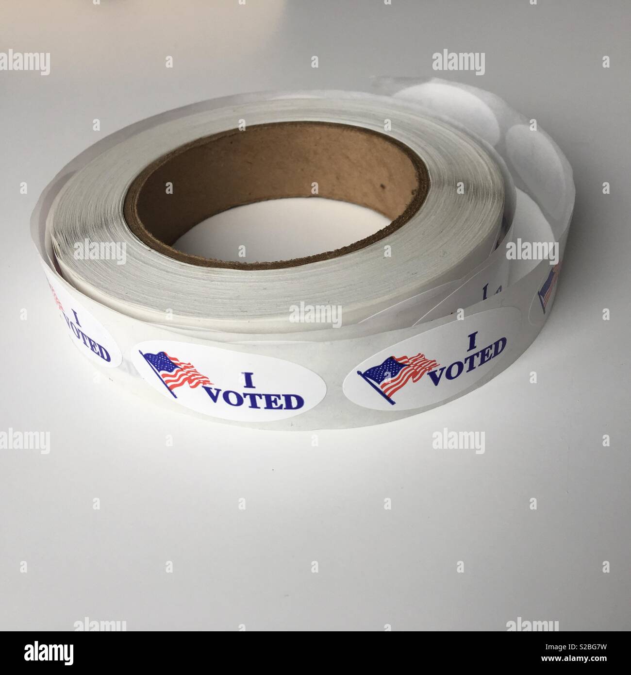 Roll of I VOTED stickers with United States flag Stock Photo - Alamy