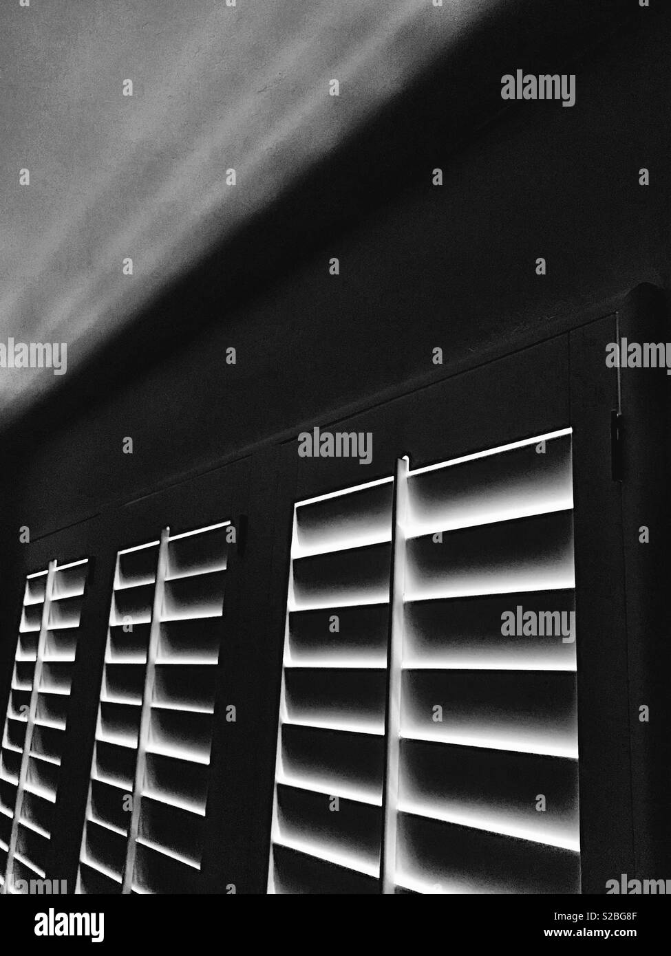 Morning light through wooden shutters Stock Photo - Alamy