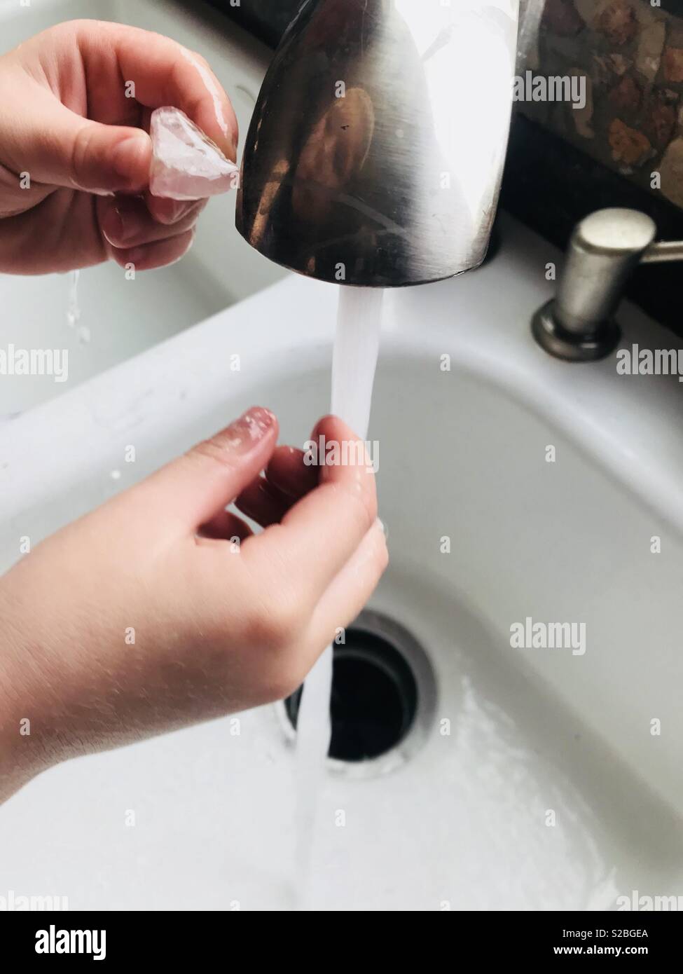 Child washing face sink hi-res stock photography and images - Alamy