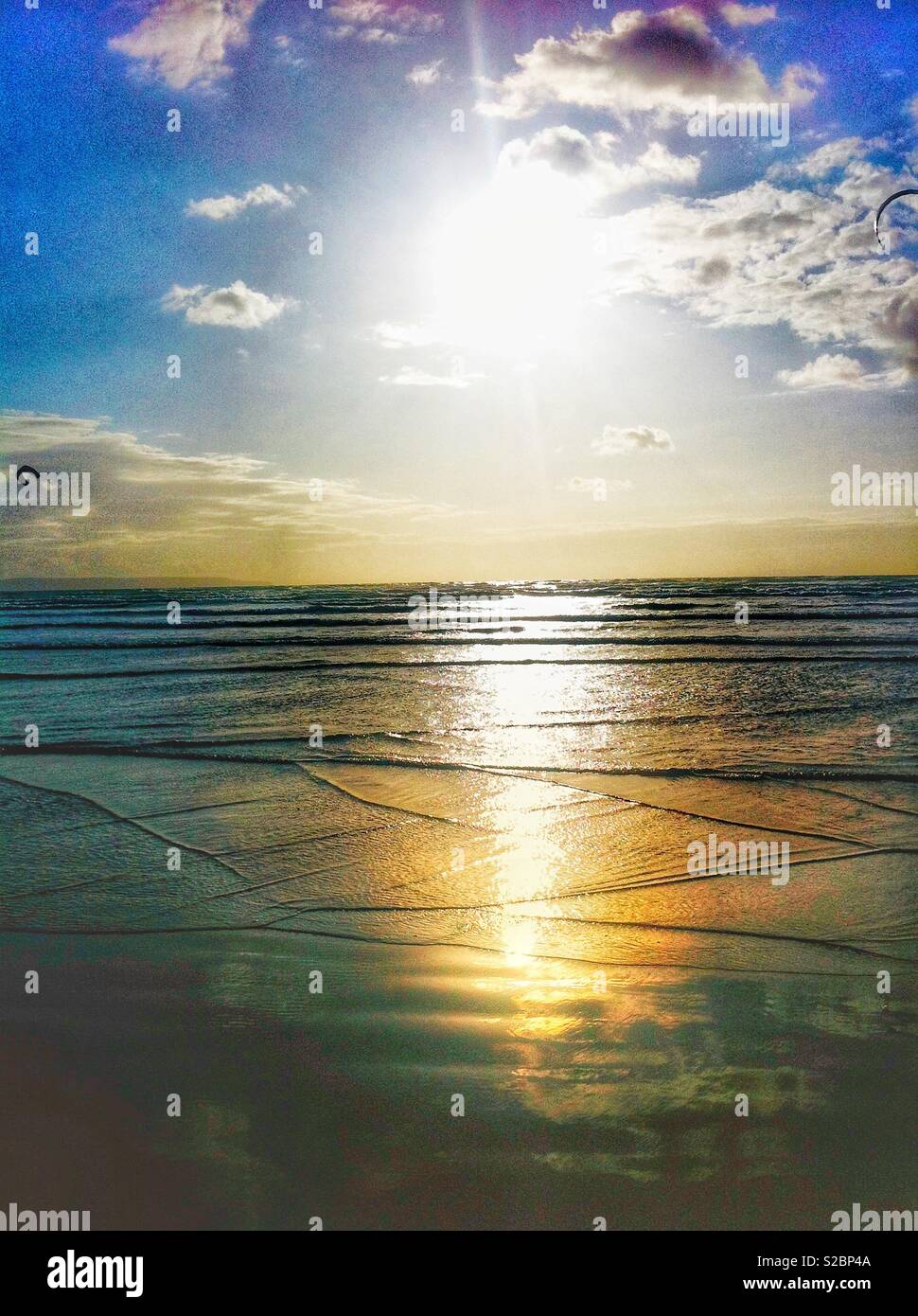 Reflection of sun on the sea in Devon Stock Photo - Alamy