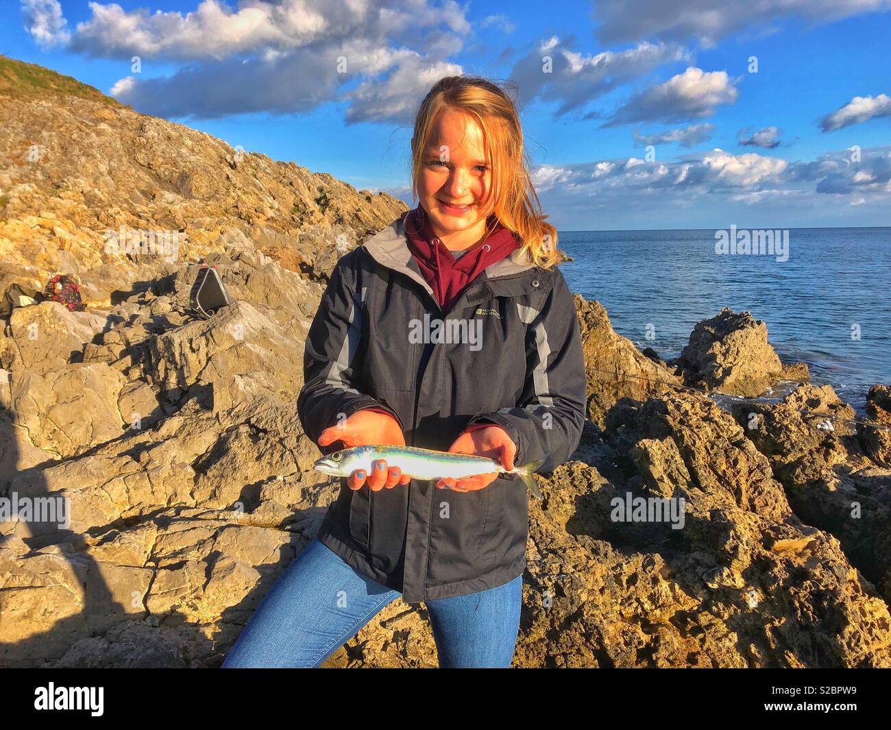 Woman holding a fish hi-res stock photography and images - Alamy