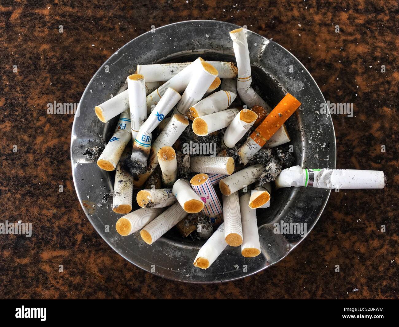 Cigarette at the smoking area Stock Photo - Alamy