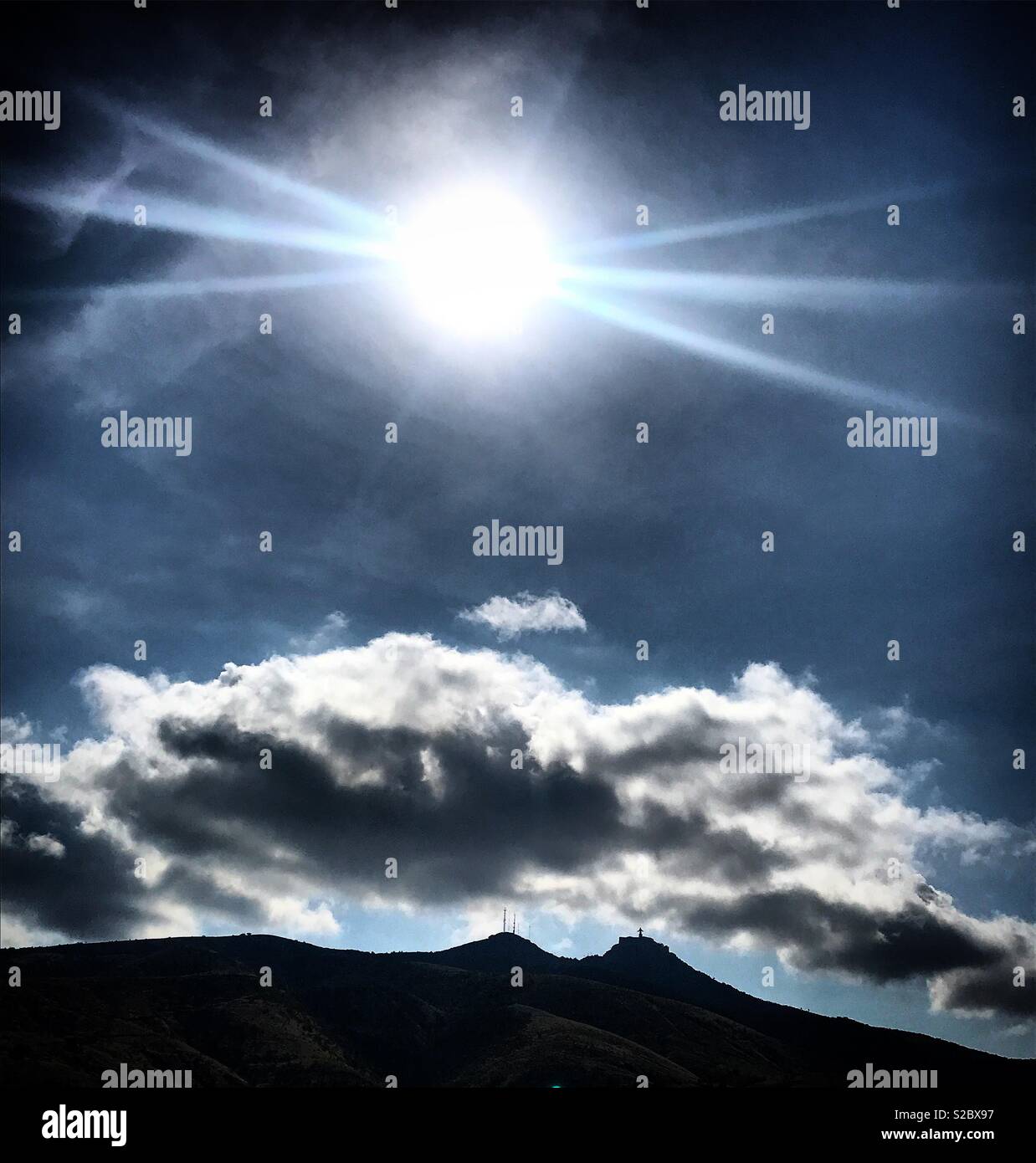 The sun shines over the Cerro del Cubilete in the hill of Cristo Rey in ...