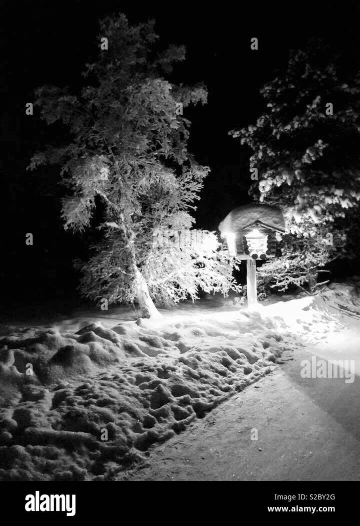 Dark path in the snow Stock Photo - Alamy