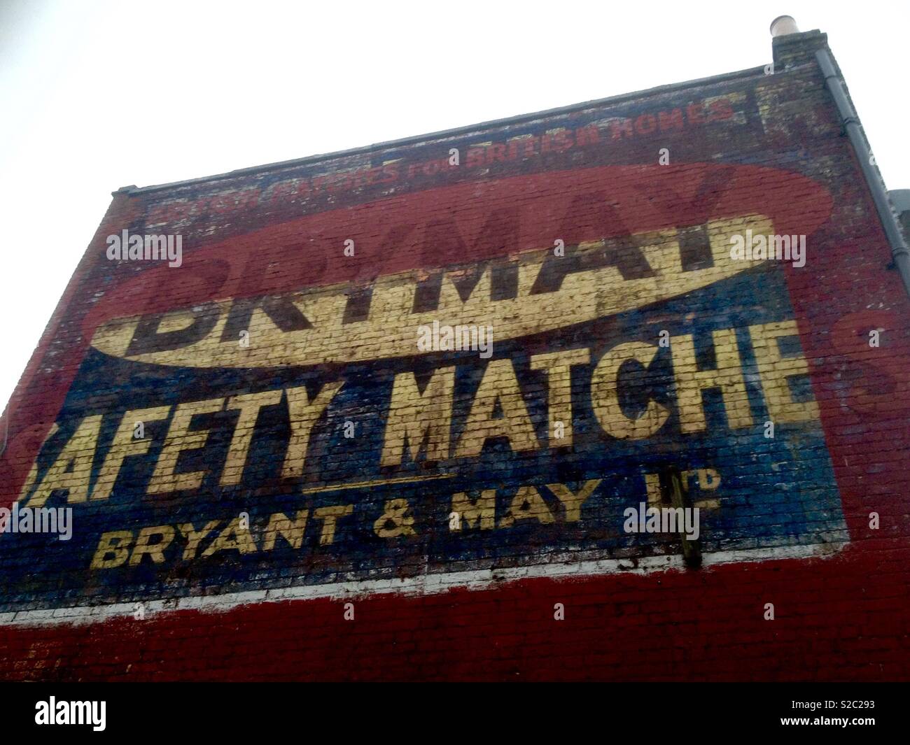 Old painted advertisement on the side of a building Stock Photo - Alamy